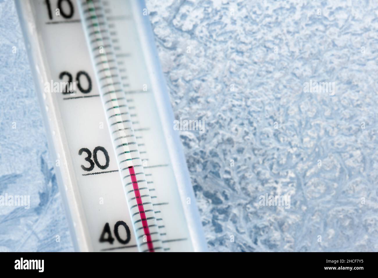 The thermometer shows a low temperature of minus 30 Celsius. Weather ...