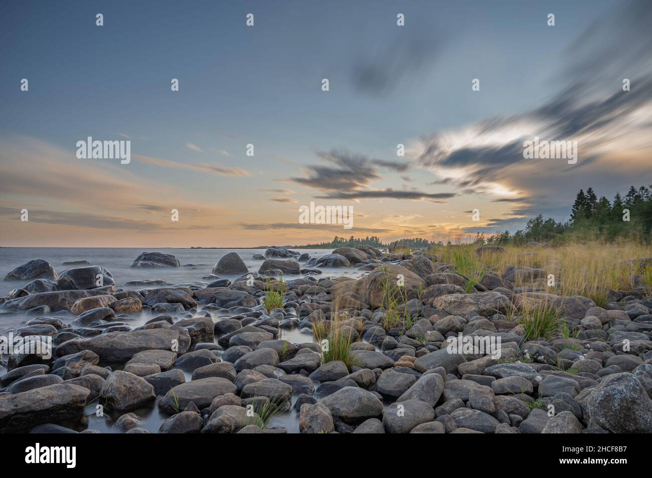 Long Exposure of Magnificent Soft and colorful sunset by the seaside ...