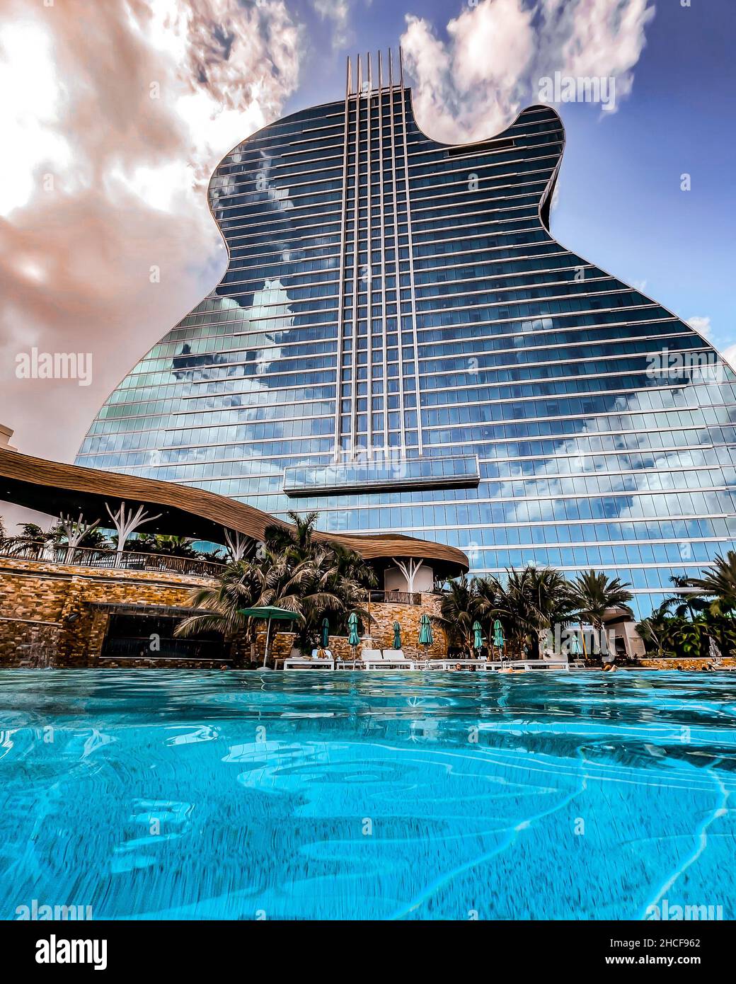Low angle shot of pool in front of Hard Rock hotel and casino in Miami ...