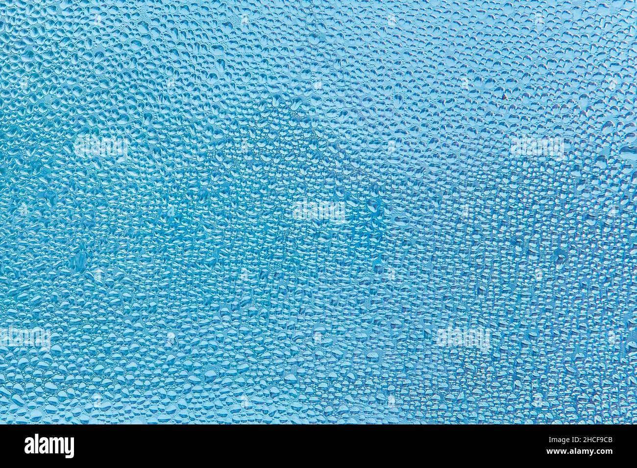 Cold blue water drops on glass window texture, winter background Stock ...