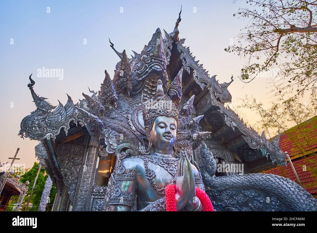 The closeup of Devata figure with Mucalinda multi-headed cobra behind ...