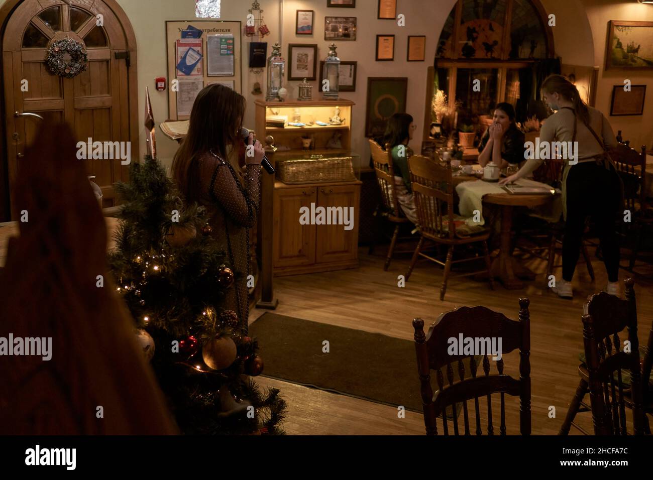 Singer Gress performs popular songs in a city-themed cafe based on the ...