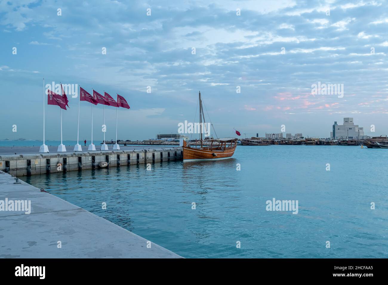 Sunrise view of Corniche Beach with Dhow boat Stock Photo - Alamy