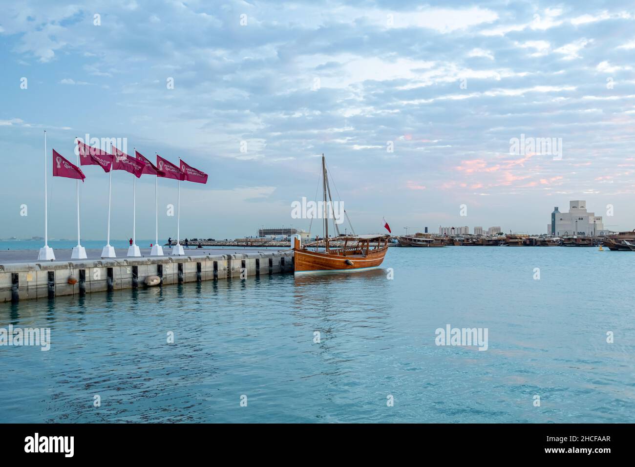 Sunrise view of Corniche Beach with Dhow boat Stock Photo - Alamy