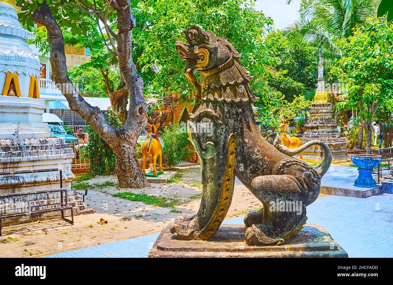 The old sculpture of the Singha lion, sitting at the Chedi of Wat Pa ...