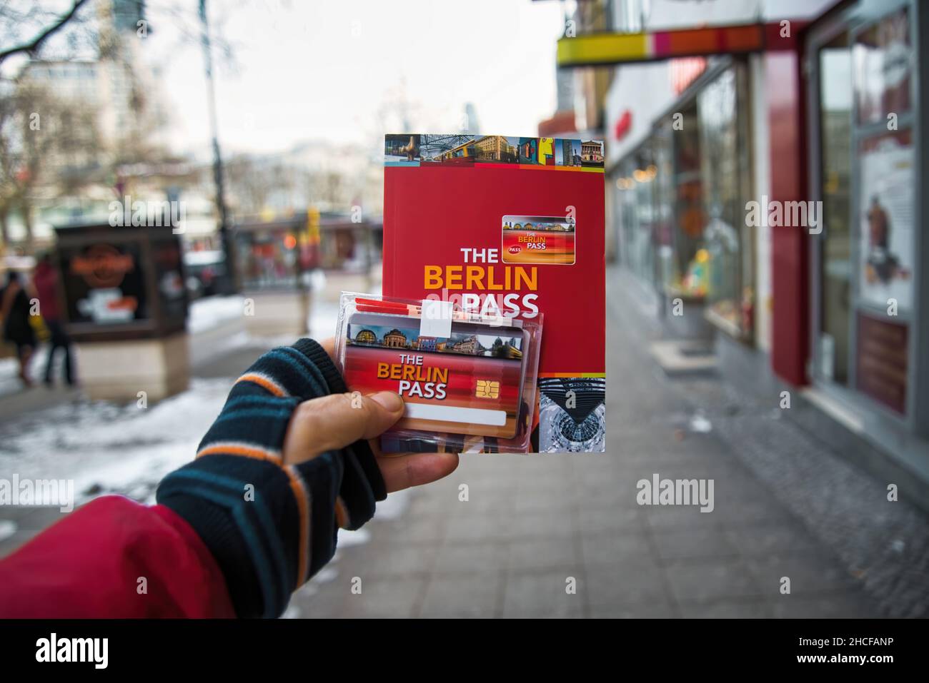 Berlin, Germany - April 04, 2014: Tourist hand holding The Berlin Pass ...