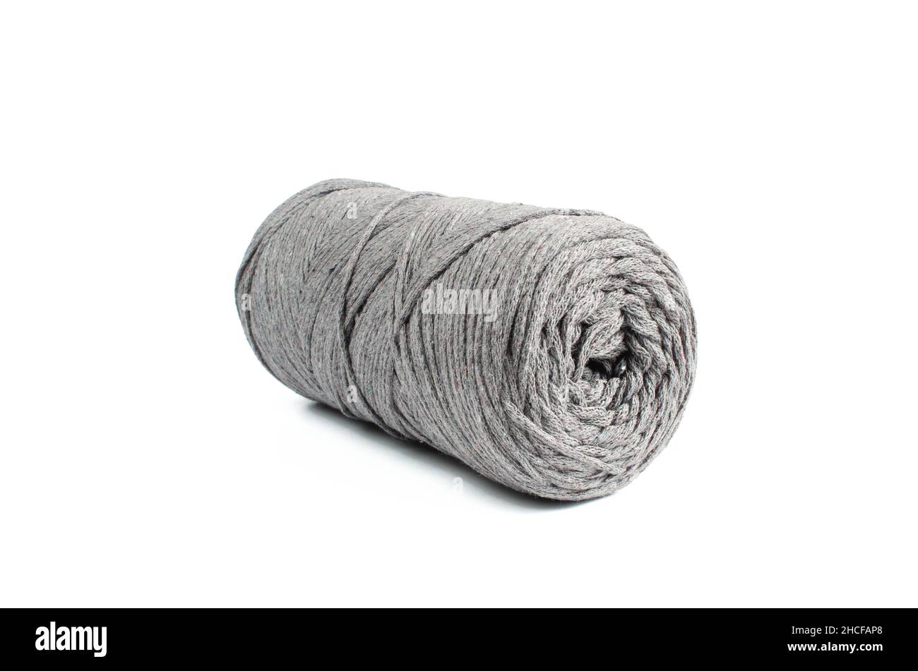 Roll of grey thread for knitting isolated on white background. Macrame ...