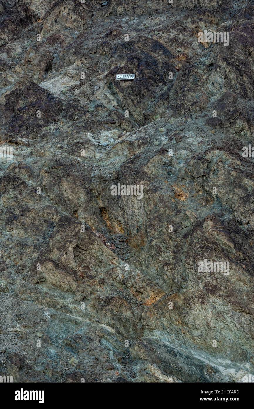 Sea Level Sign Stands High Above Badwater Basin on cliff in Death ...