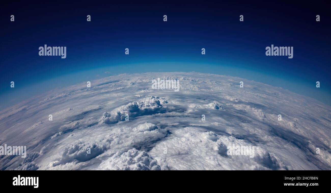 Planet Earth Curvature. Aerial view. Blue sky over heavy cloudscape ...