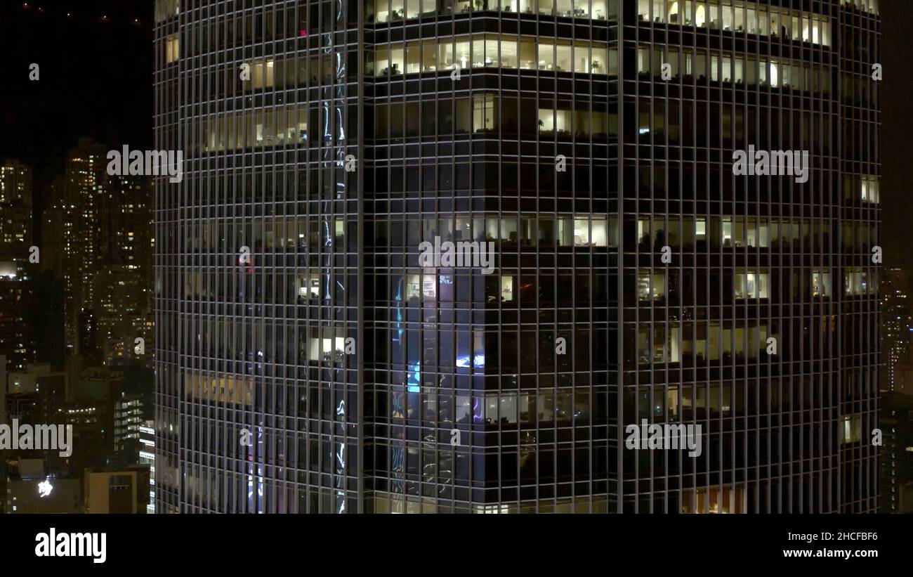 Unique Aerial flight around and approach to windows. Evening ...