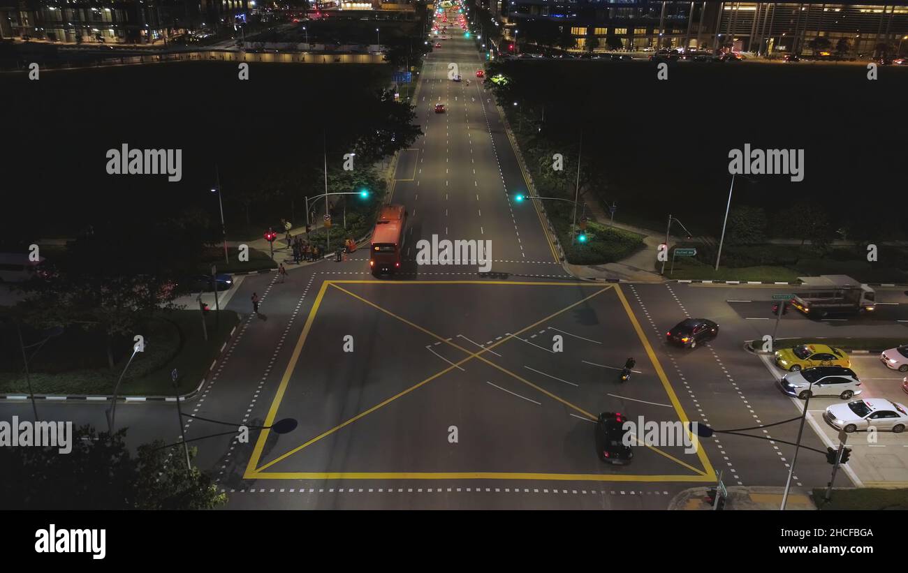 The light on the crossroad at night and movement of cars. Road ...
