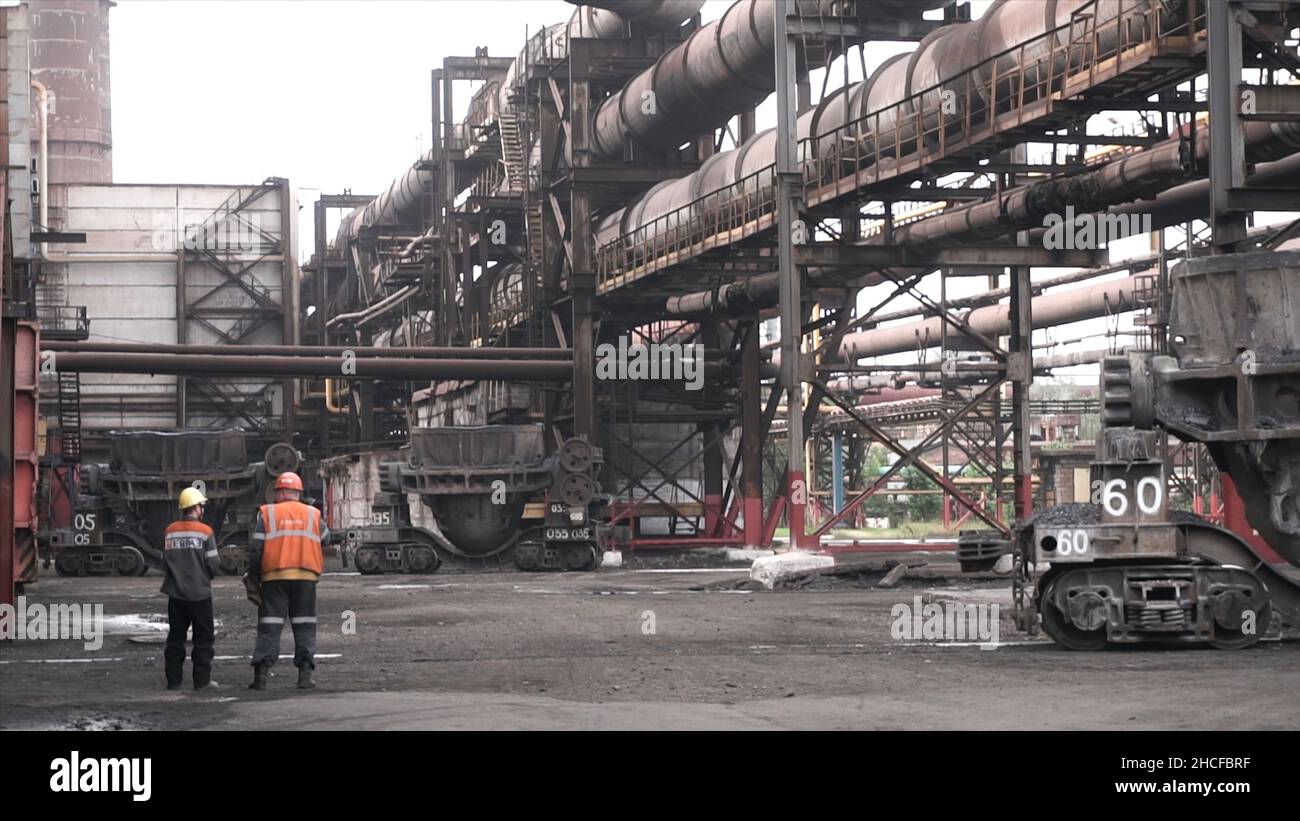 Metal melting vats being transported on big carts to the metal melting ...