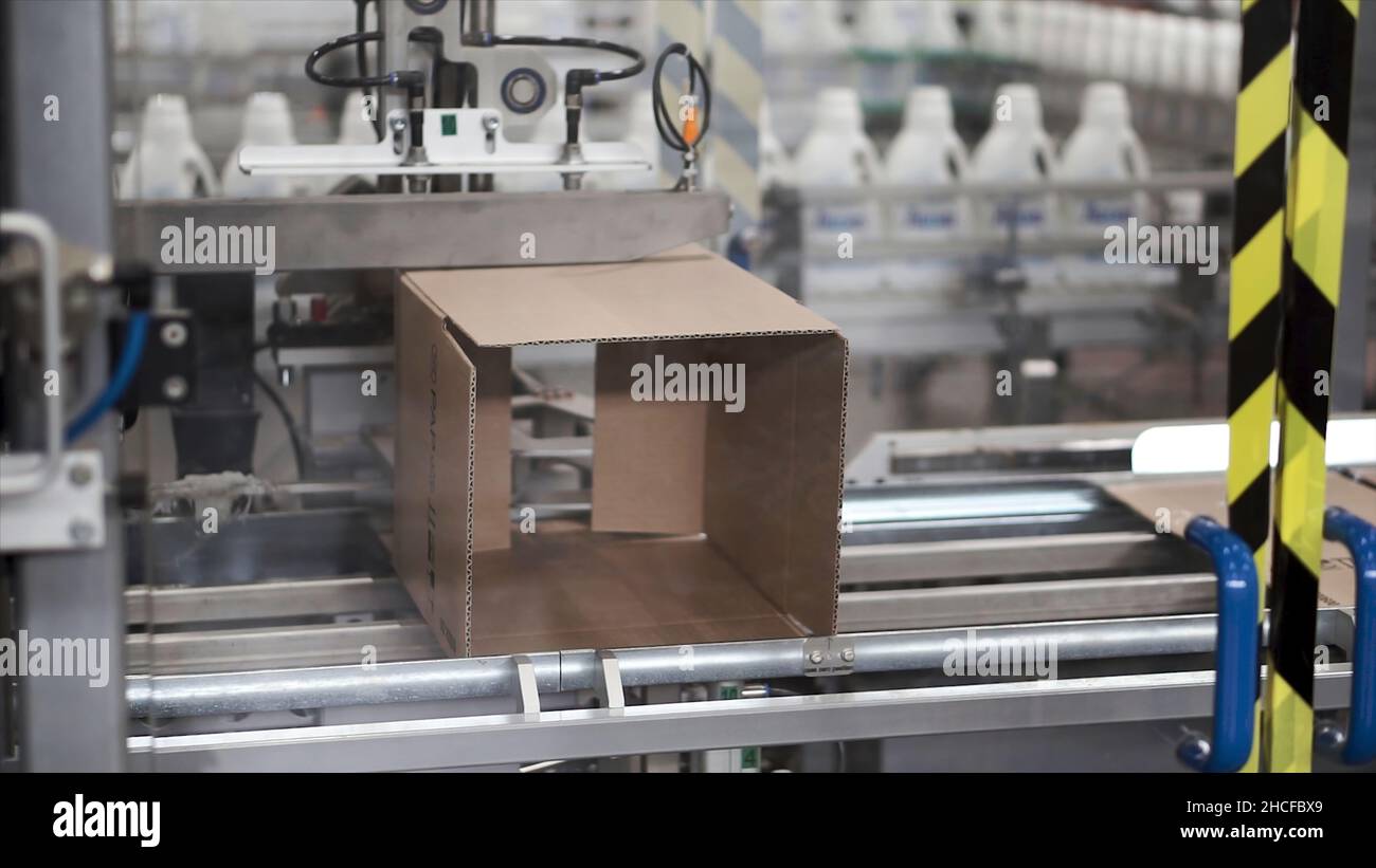 Cardboard boxes on conveyor belt in factory. Cardboard boxes on ...