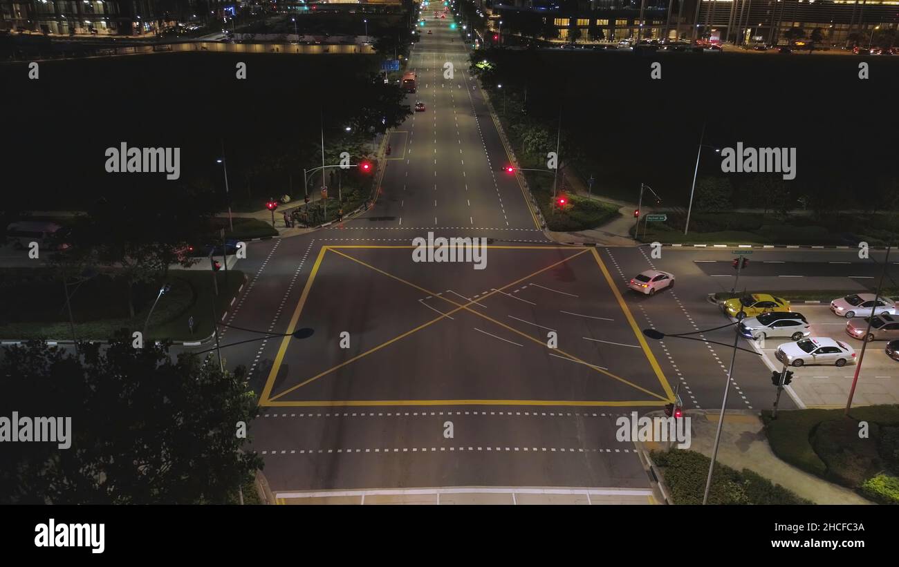 The light on the crossroad at night and movement of cars. Road ...