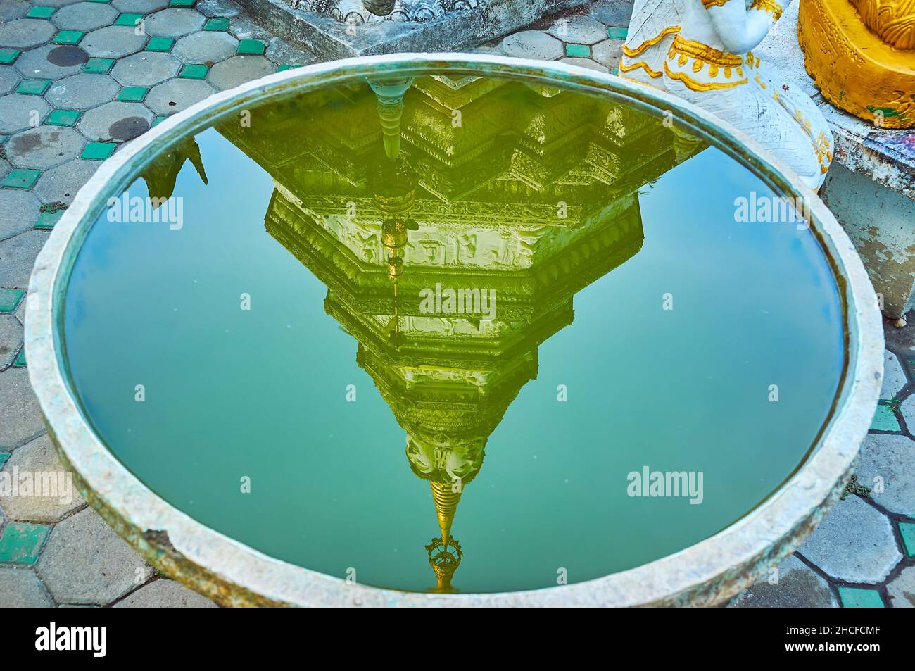 The water bowl reflects the medieval Chedi of Wat Phan Waen (Pan Waen ...