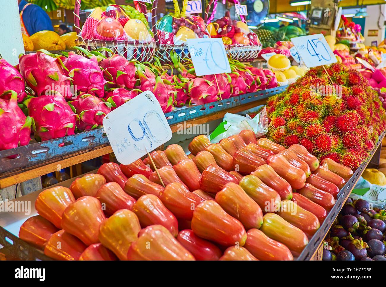 The heaps of beautiful fresh rose-apples, rambutans, dragon fruits and ...