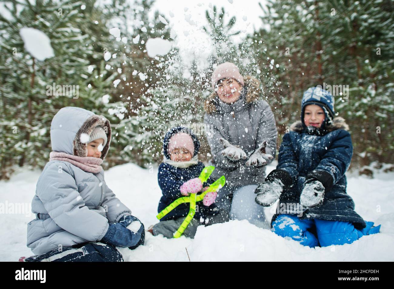 Mother with three children in winter nature. Outdoors in snow Stock ...