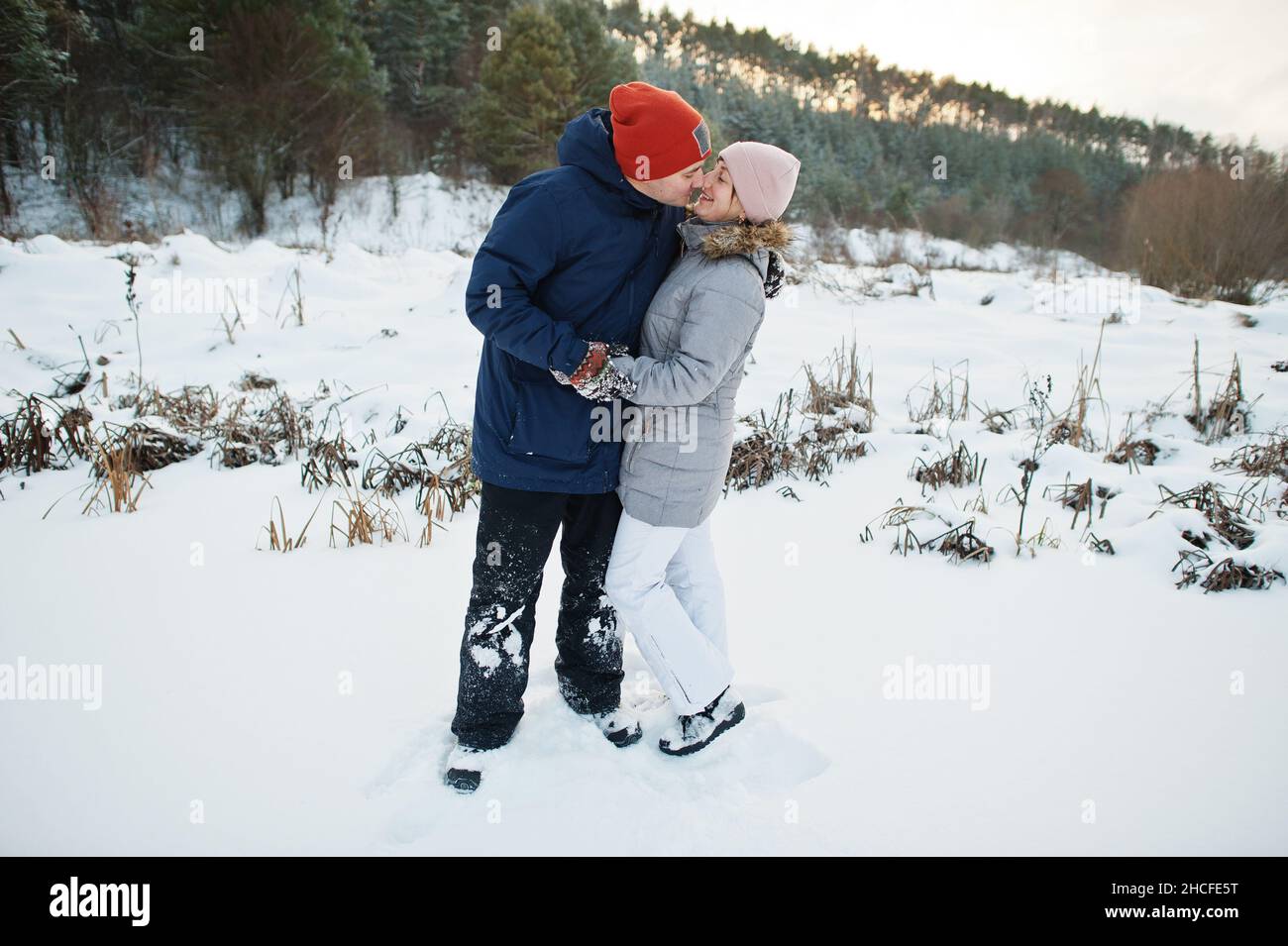 Couple hugs in winter forest hi-res stock photography and images - Alamy