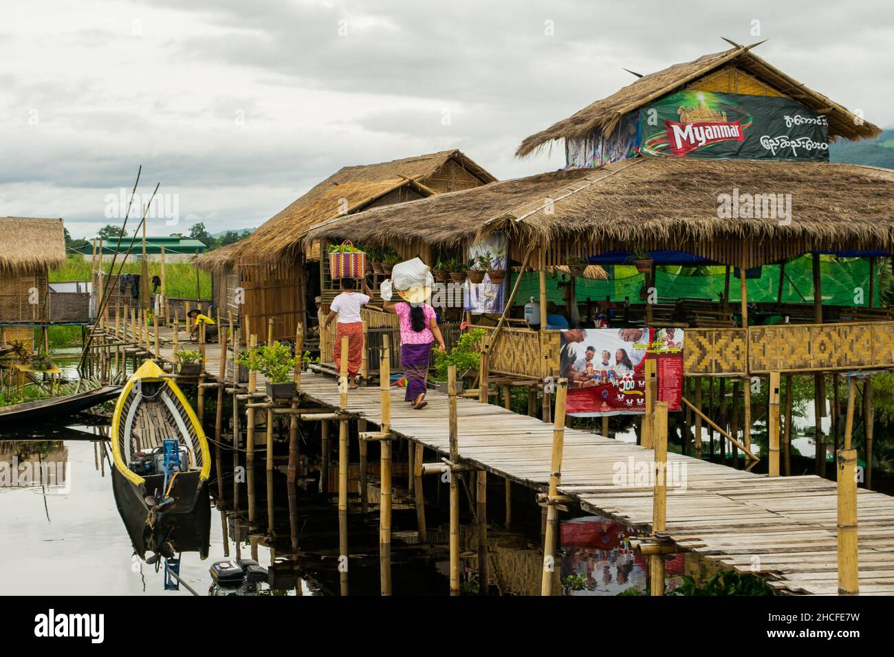 Floating houses and buildings built on the water or riverbank of Inle ...