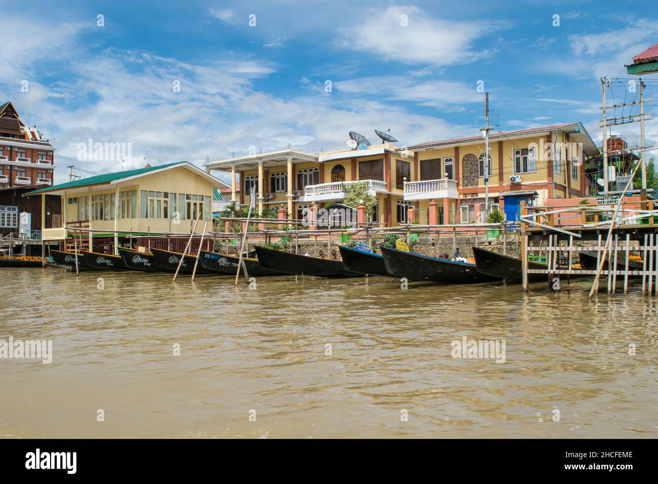 Floating houses and buildings built on the water or riverbank of Inle ...