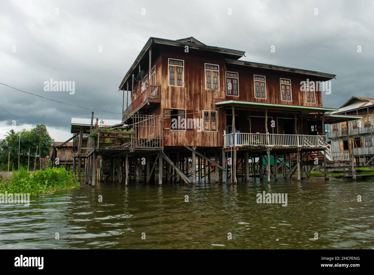 Floating houses and buildings built on the water or riverbank of Inle ...