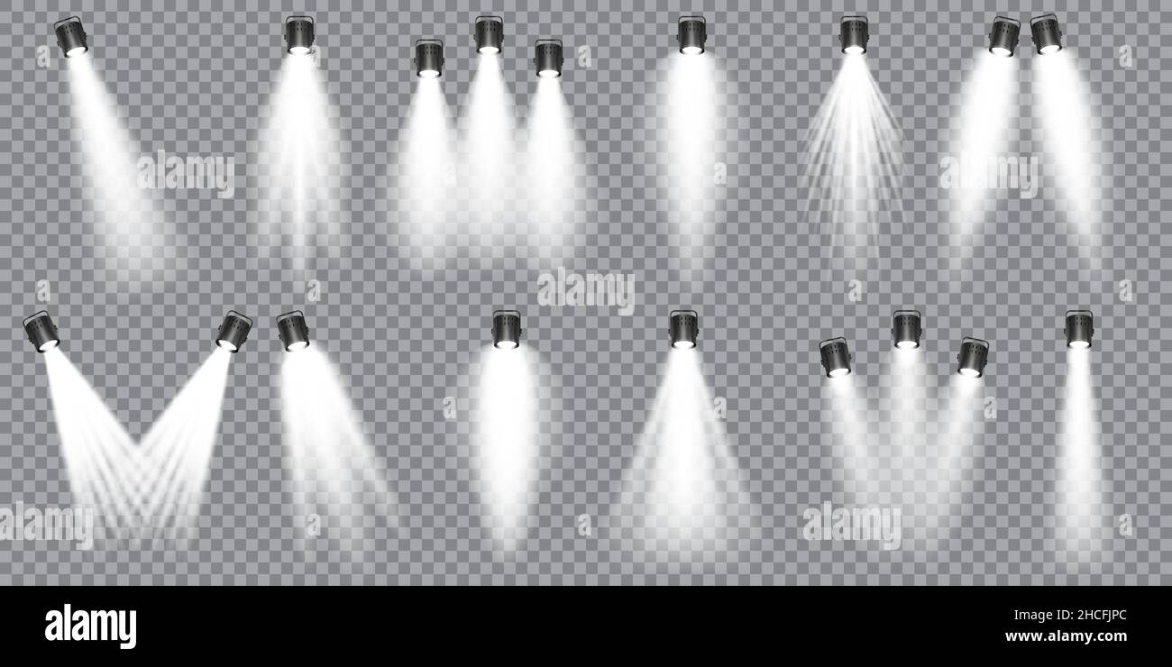 Illuminated studio spotlights collection. Bright light beam ...