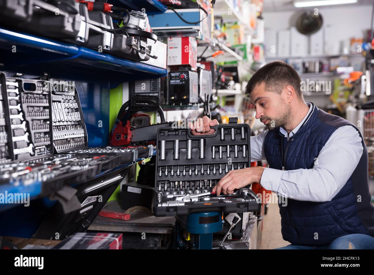purchaser is choosing ratchet Stock Photo - Alamy
