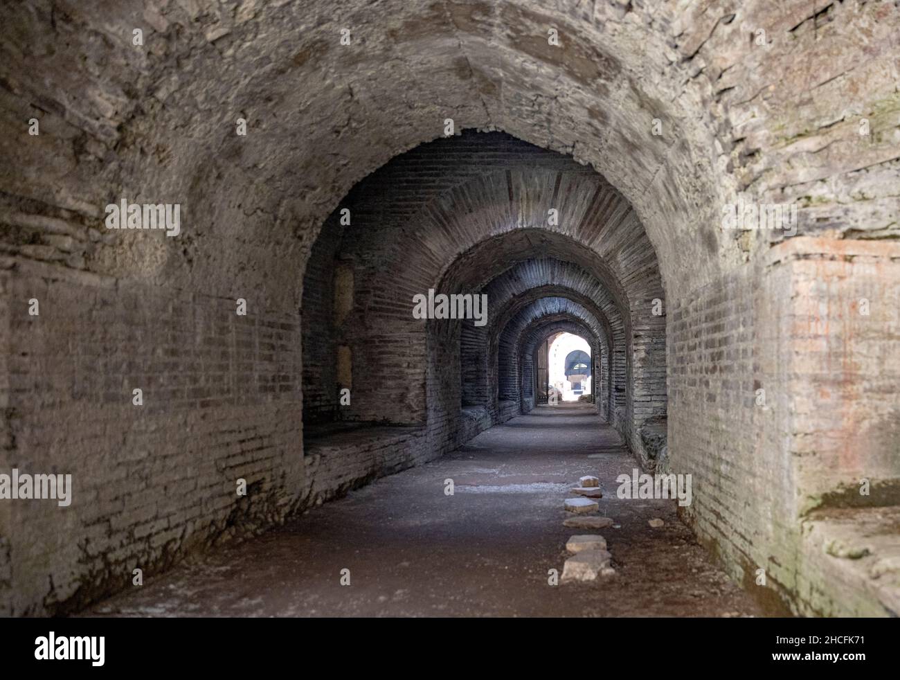 Historic stone tunnel through the Colosseum in Capua, Italy Stock Photo ...