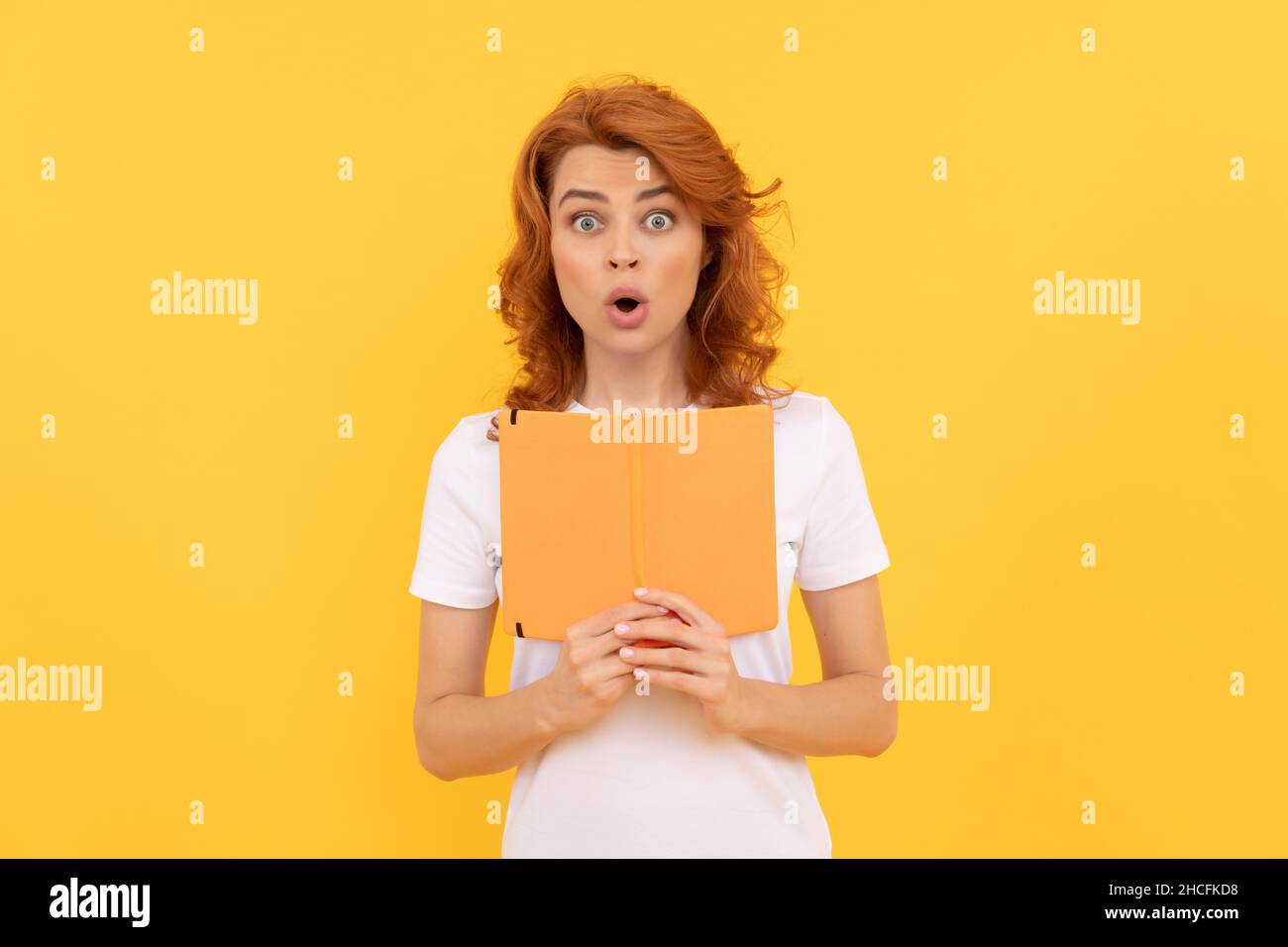 woman reader reading. shocked student on yellow background. girl study ...