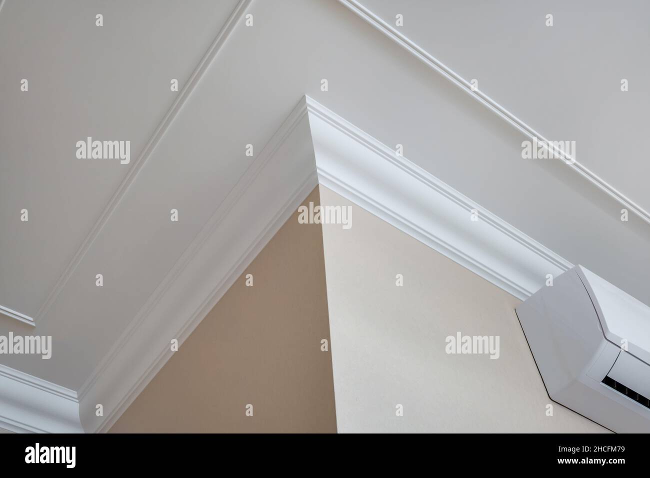 Detail of corner ceiling cornice with intricate crown molding Stock ...
