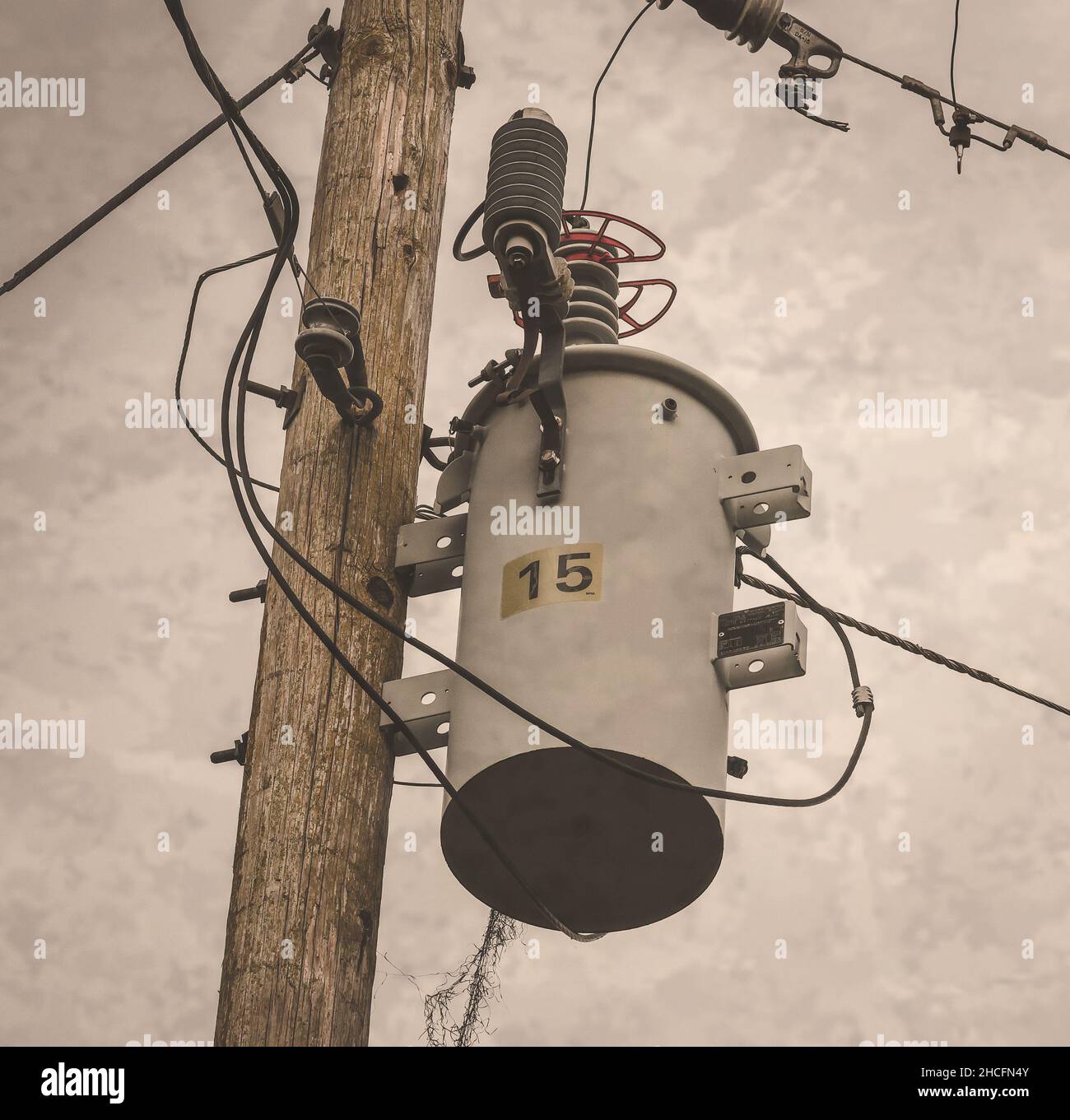 Low angle shot of a power transformer on a wooden pole Stock Photo - Alamy