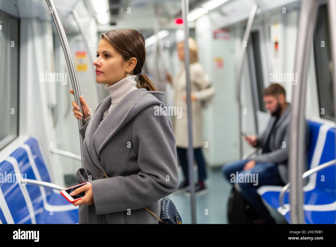 Pretty woman in public land transport Stock Photo - Alamy