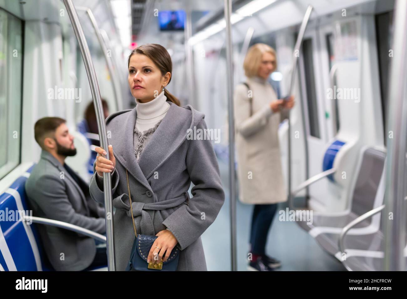 Pretty woman in public land transport Stock Photo - Alamy