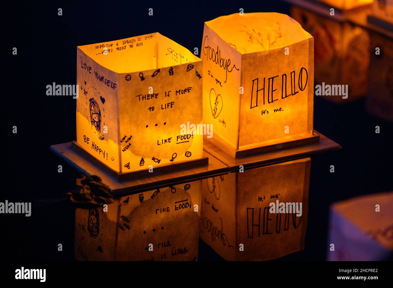 Some handmade craft lamps on a reflecting surface Stock Photo - Alamy