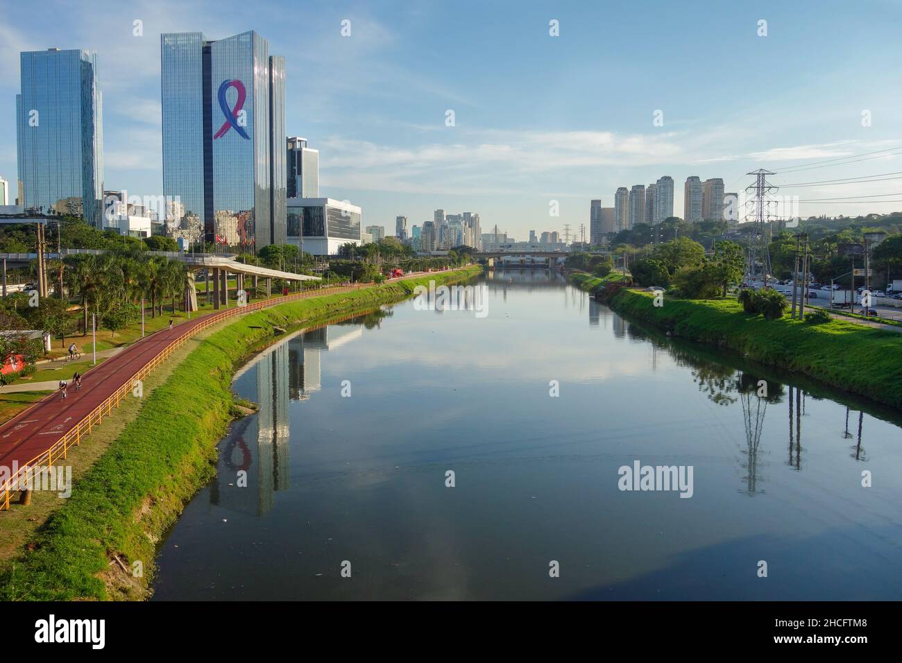 Beautiful view of bike lane and Pinheiros river and cityscape buildings ...