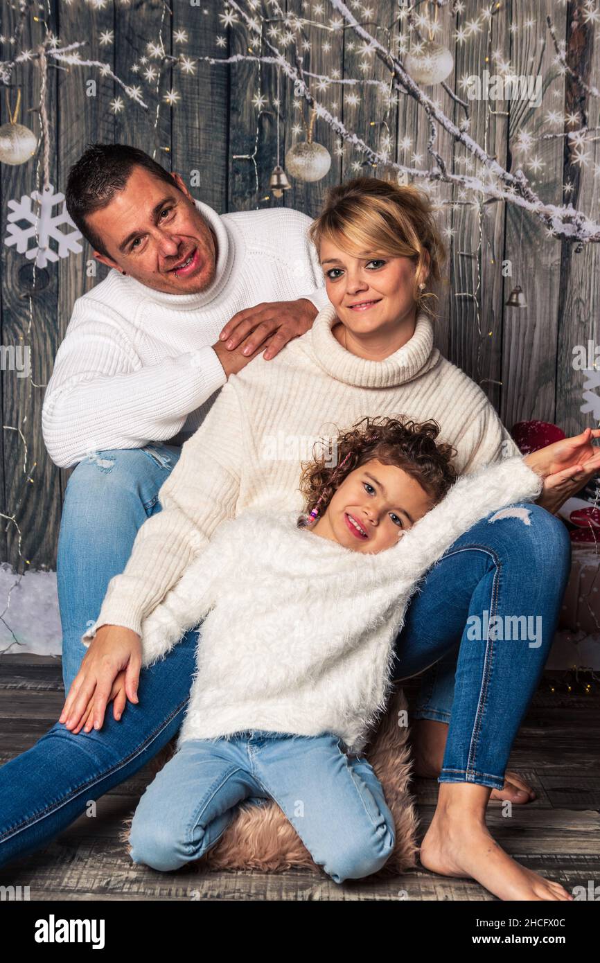 Adorable Spanish family having a groupie during a Christmas event Stock ...