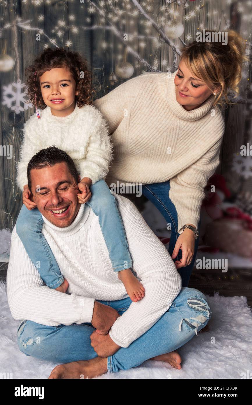 Adorable Spanish family having a groupie during a Christmas event Stock ...