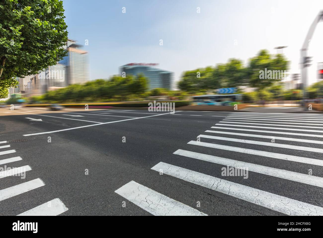 empty road with zebra crossing and skyscrapers in modern city Stock ...