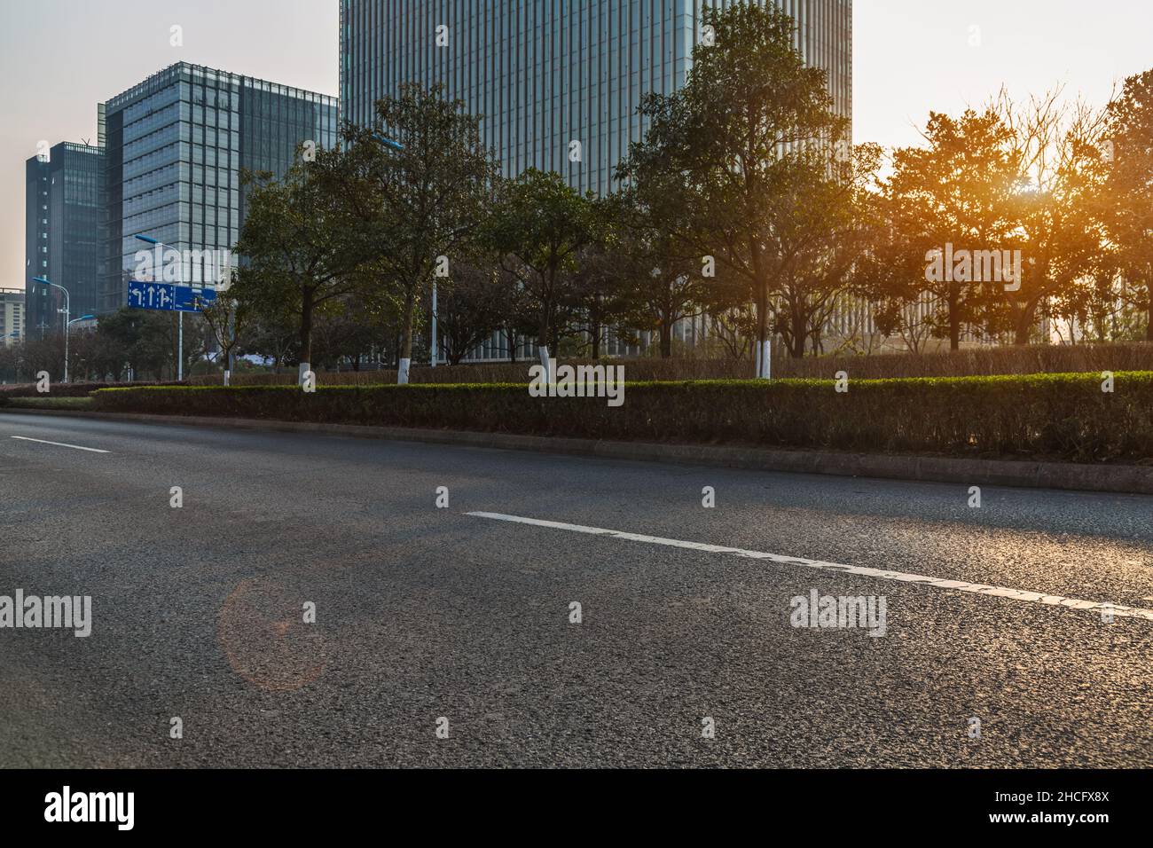 city empty traffic road with cityscape in background Stock Photo - Alamy