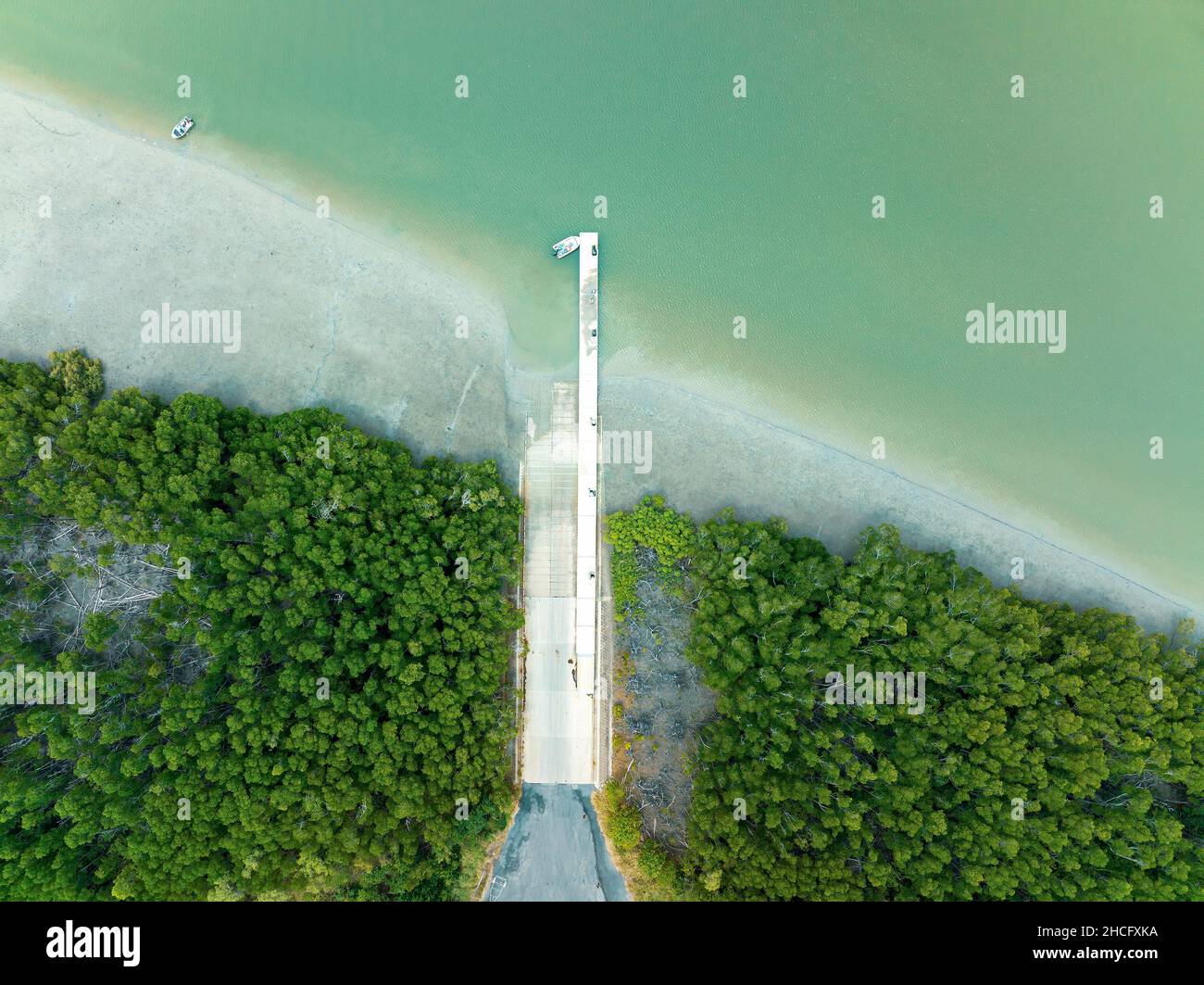 Drone overhead of Conway Beach boat ramp and jetty while tide is ...