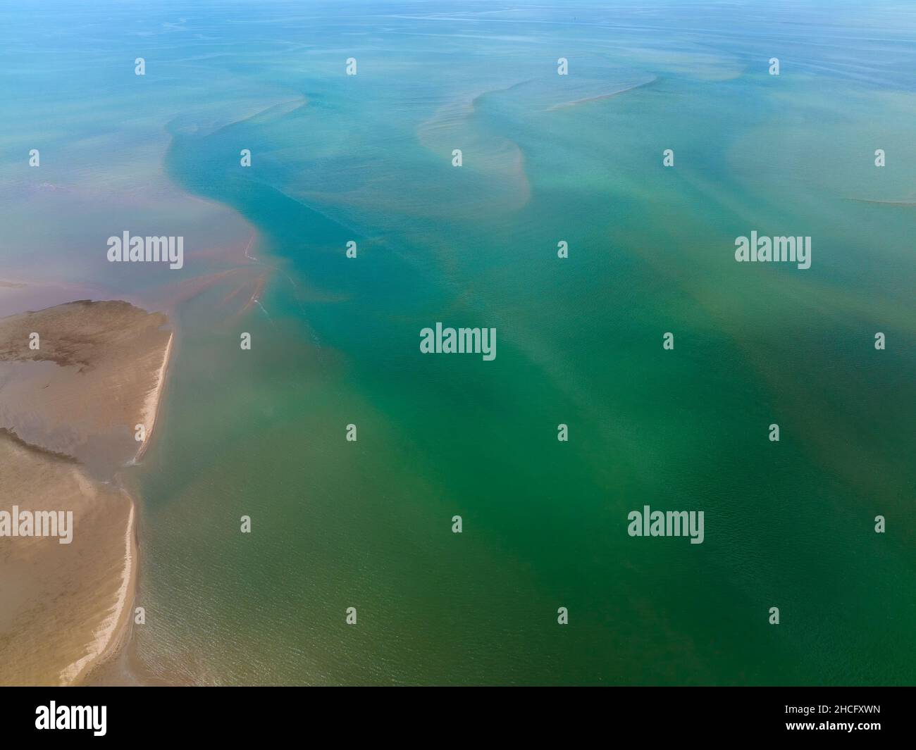 Patterns in the sand of the ocean bed at low tide on a beach, drone ...