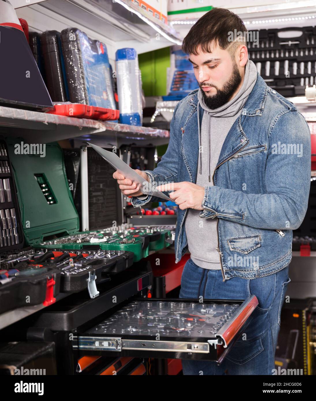 Male is standing with new ratchet Stock Photo - Alamy