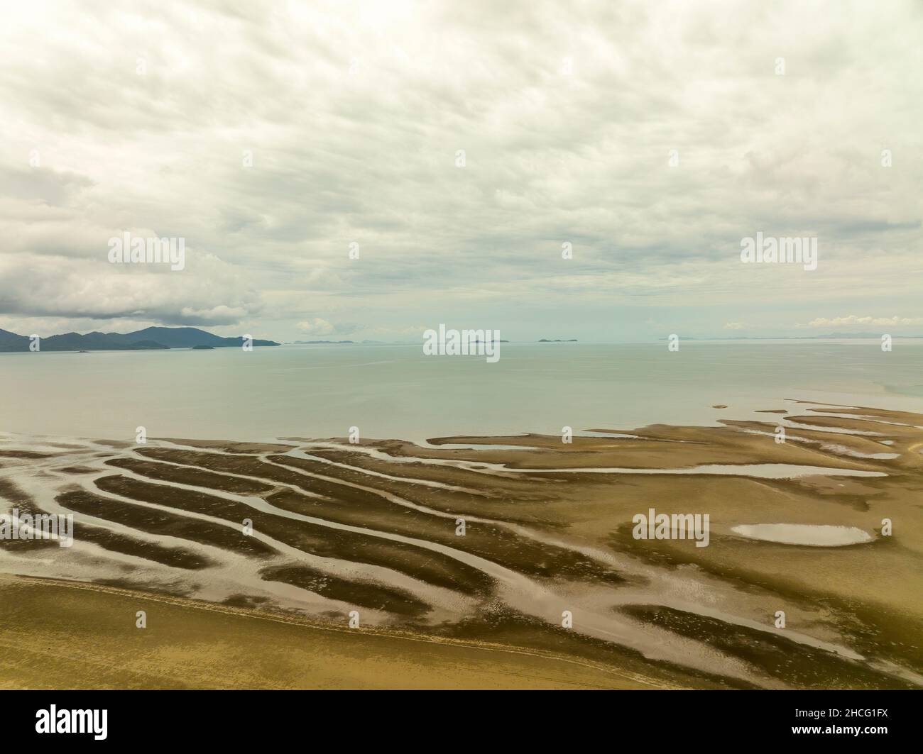 Textured patterns in the sand drone aerial seascape of Conway Beach ...