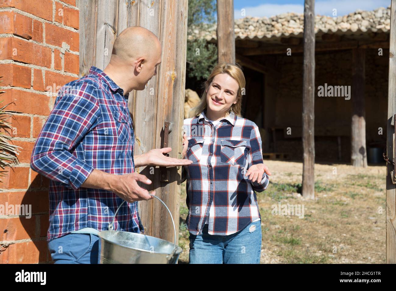 Woman talking to male neighbor Stock Photo - Alamy