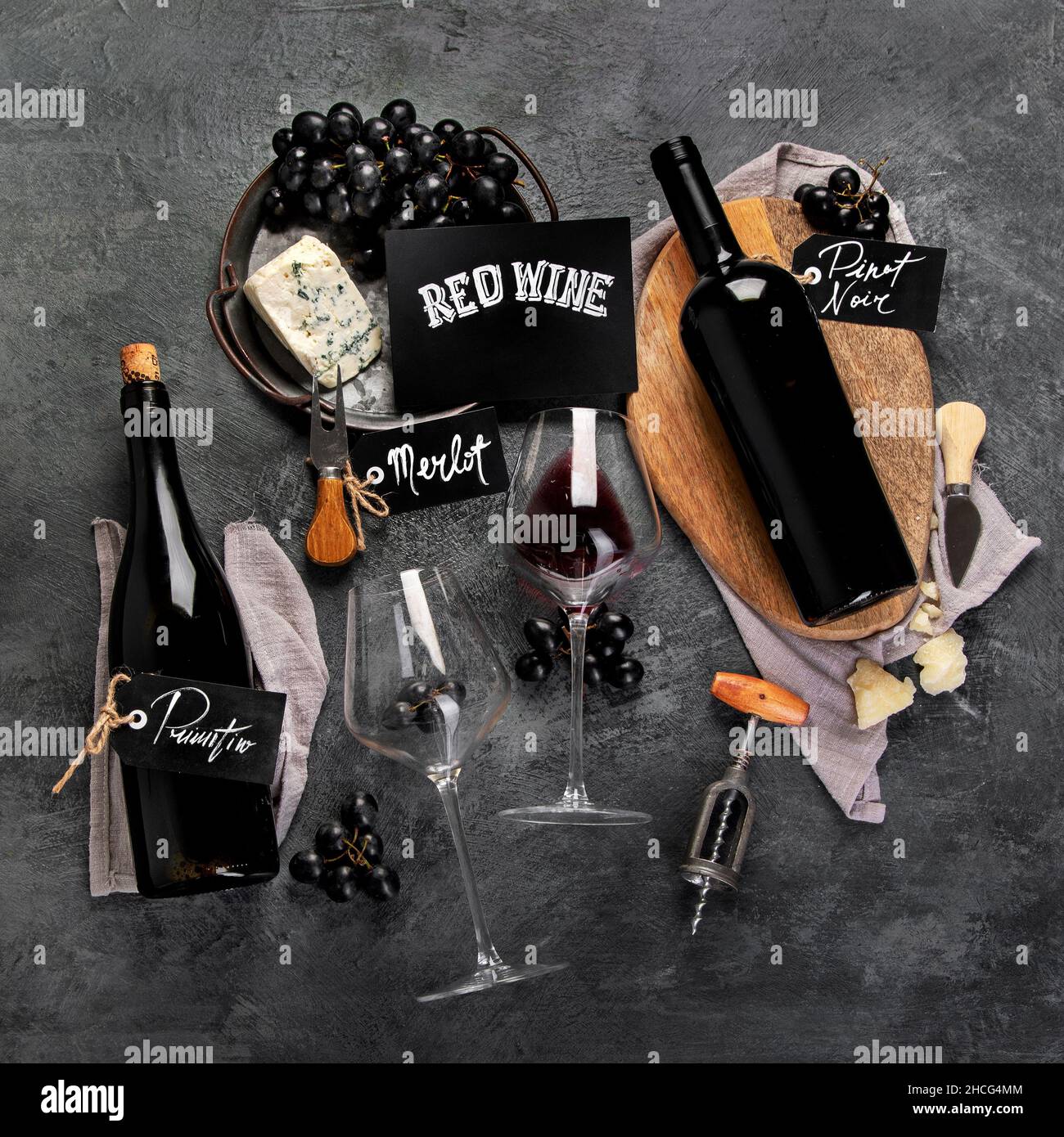 Red wine assortment with appetizers on gray background. Traditional ...