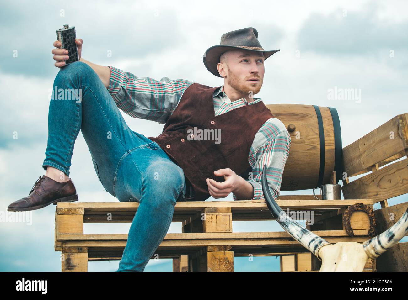 Cowboy drinking whiskey hi-res stock photography and images - Alamy