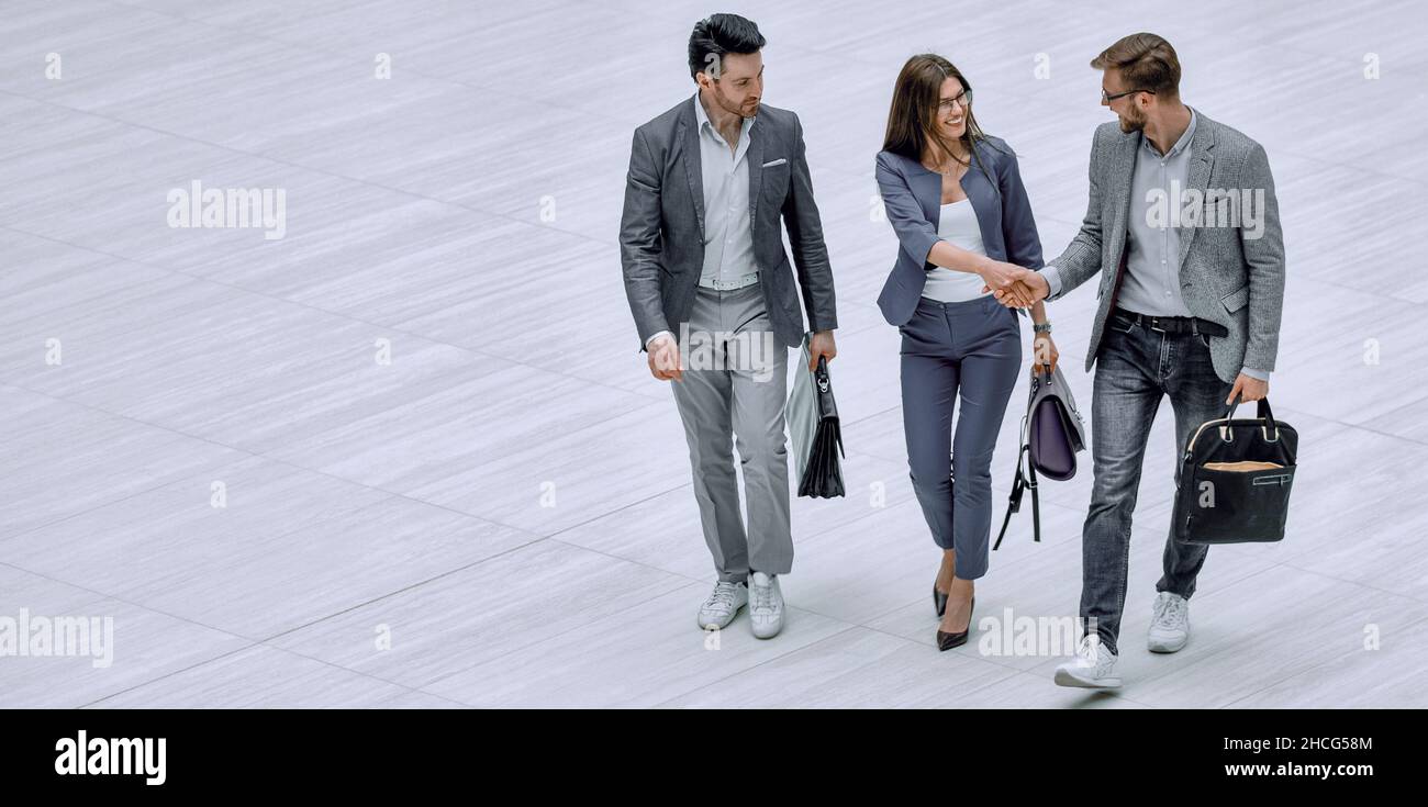 Woman handshake walking hi-res stock photography and images - Alamy