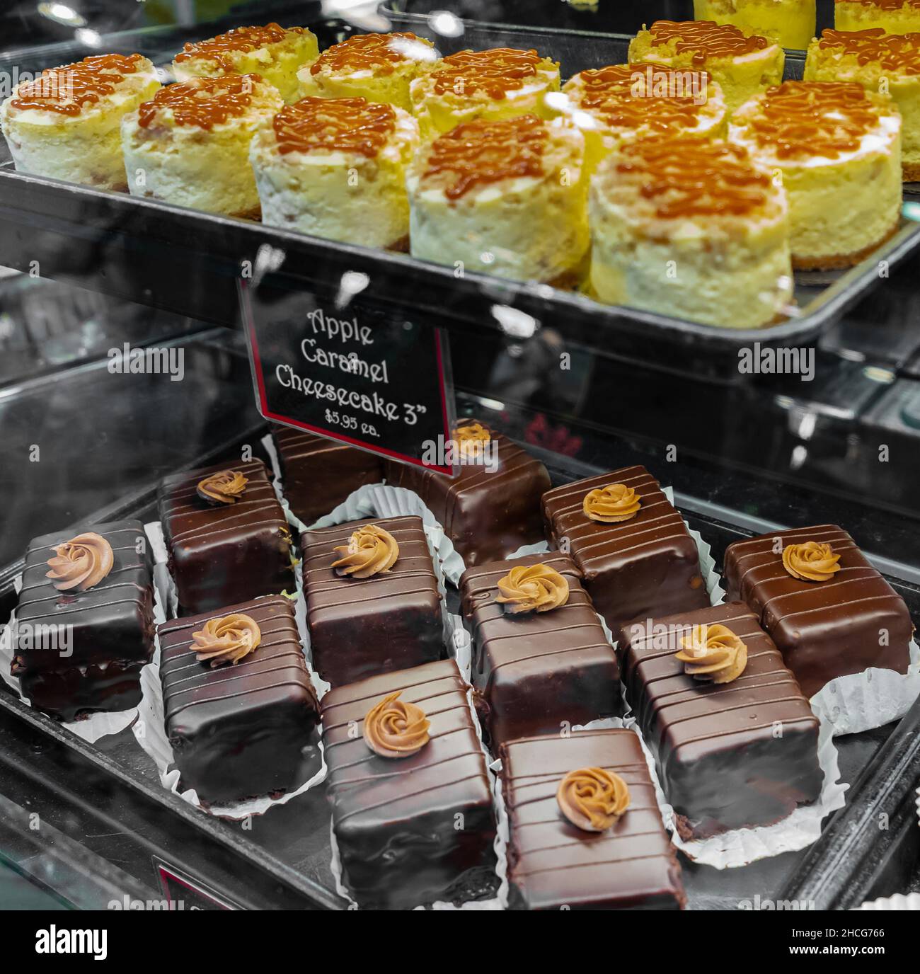 Cake displayed in shop window of confectionery or cafe. Fresh pastries ...