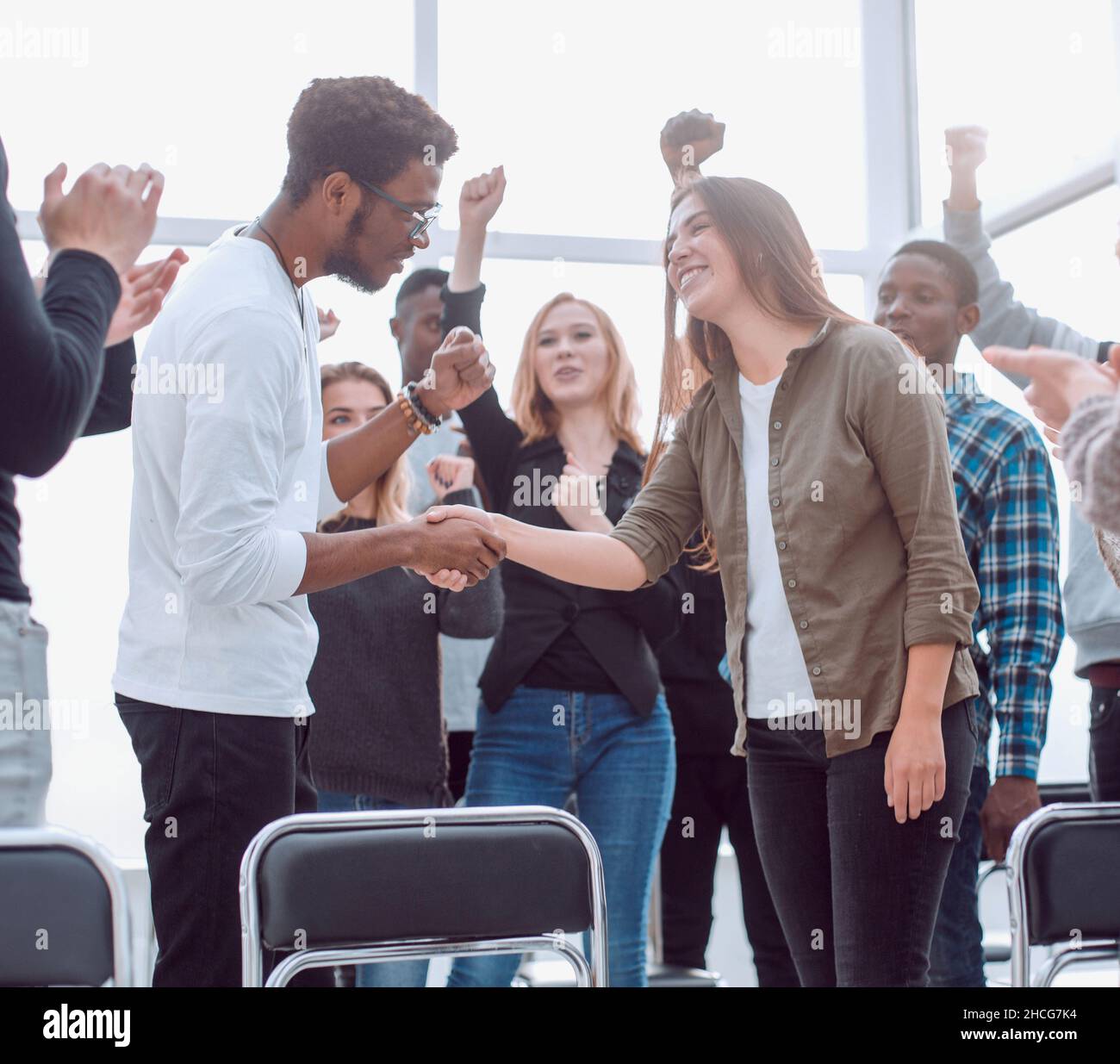 group of happy young people congratulating their colleague Stock Photo ...