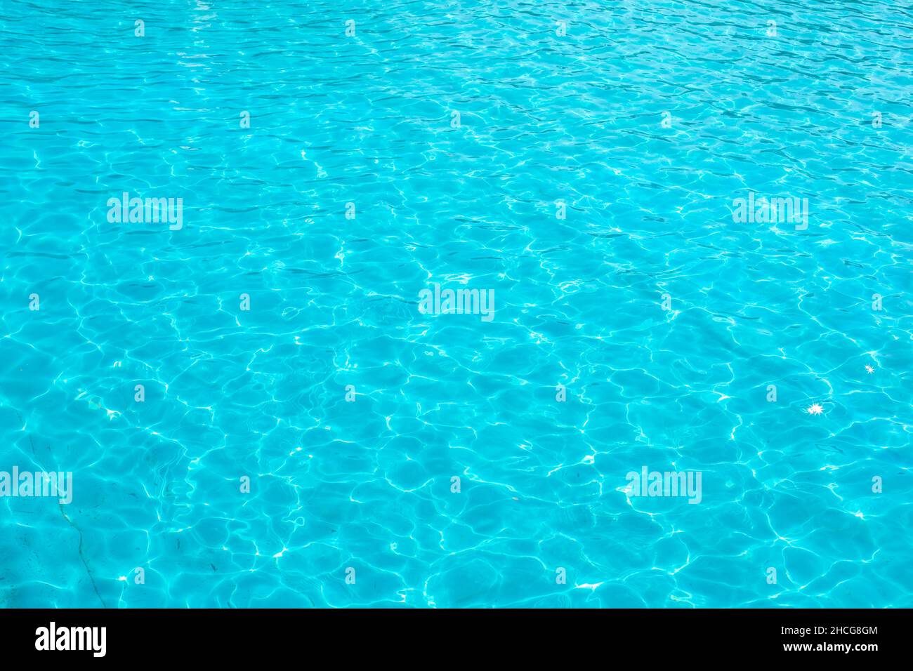 Blue pool surface, clear water in an open-air pool, water ripple ...